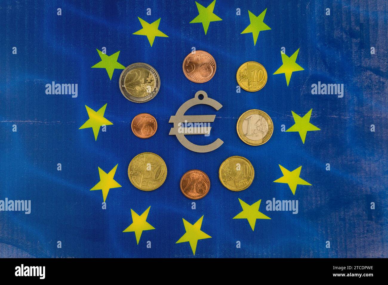 flag of EU with Euro sign and coins, Europe Stock Photo - Alamy