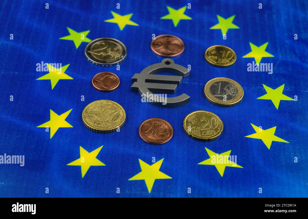 flag of EU with Euro sign and coins, Europe Stock Photo - Alamy