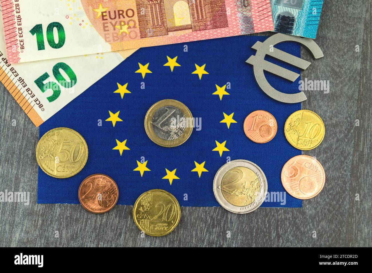 flag of EU with Euro sign, bills and coins, Europe Stock Photo - Alamy