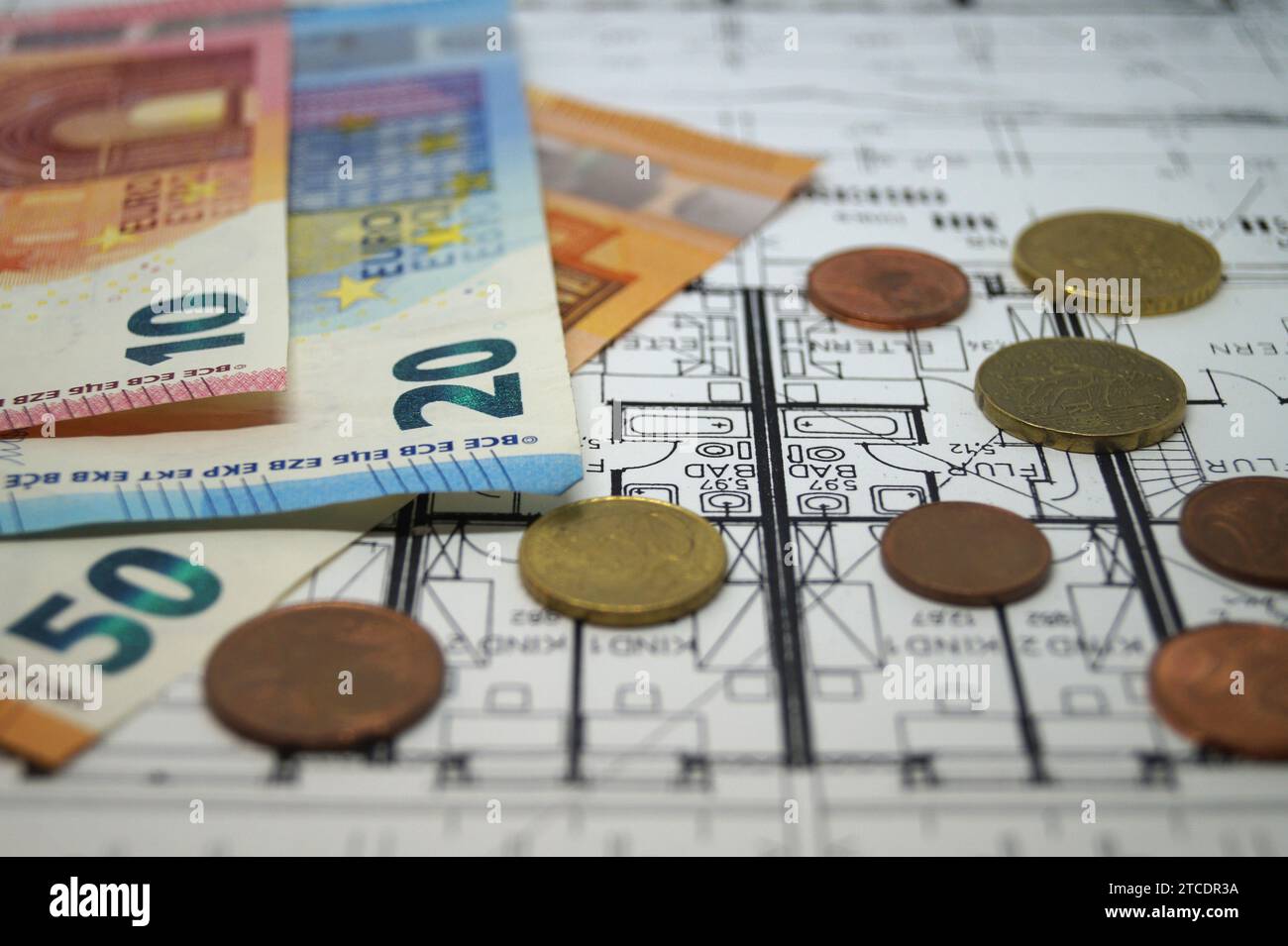 construction drawing and money, symbol image for construction costs ...