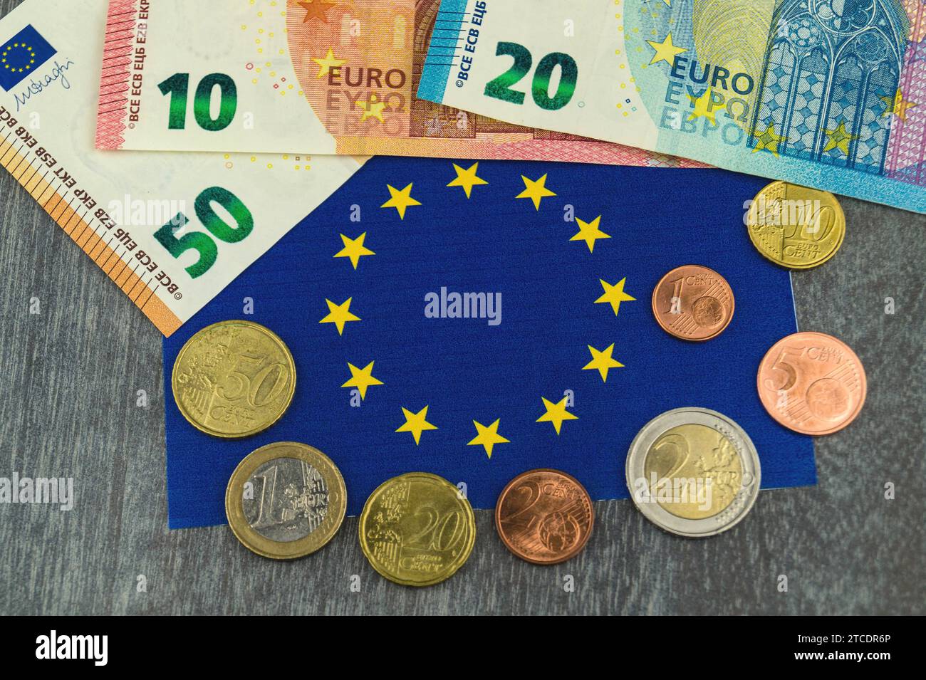 flag of EU with Euro sign, bills and coins, Europe Stock Photo - Alamy