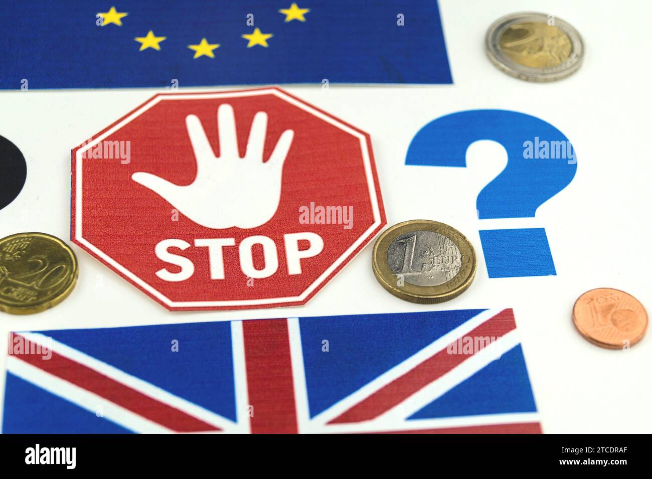 flags of EU and Great Britain with question marks, Euros and stop sign ...