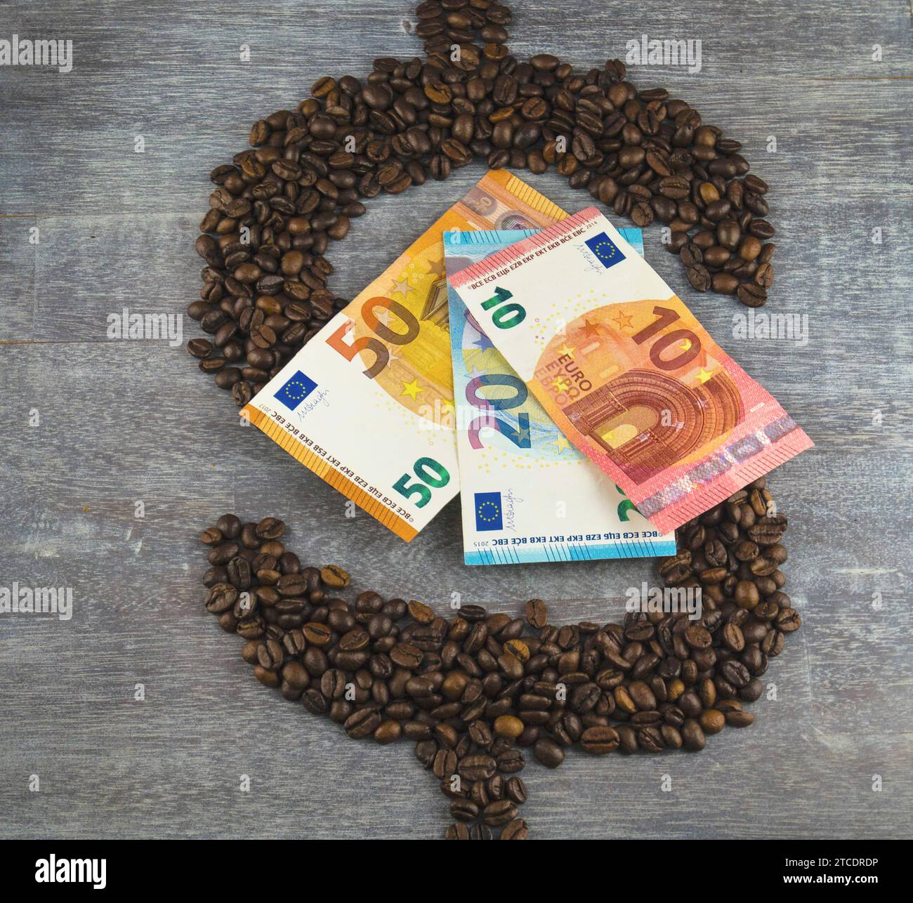 Dollar sign, formed with roasted coffee beans, with Euro bills, coffee ...