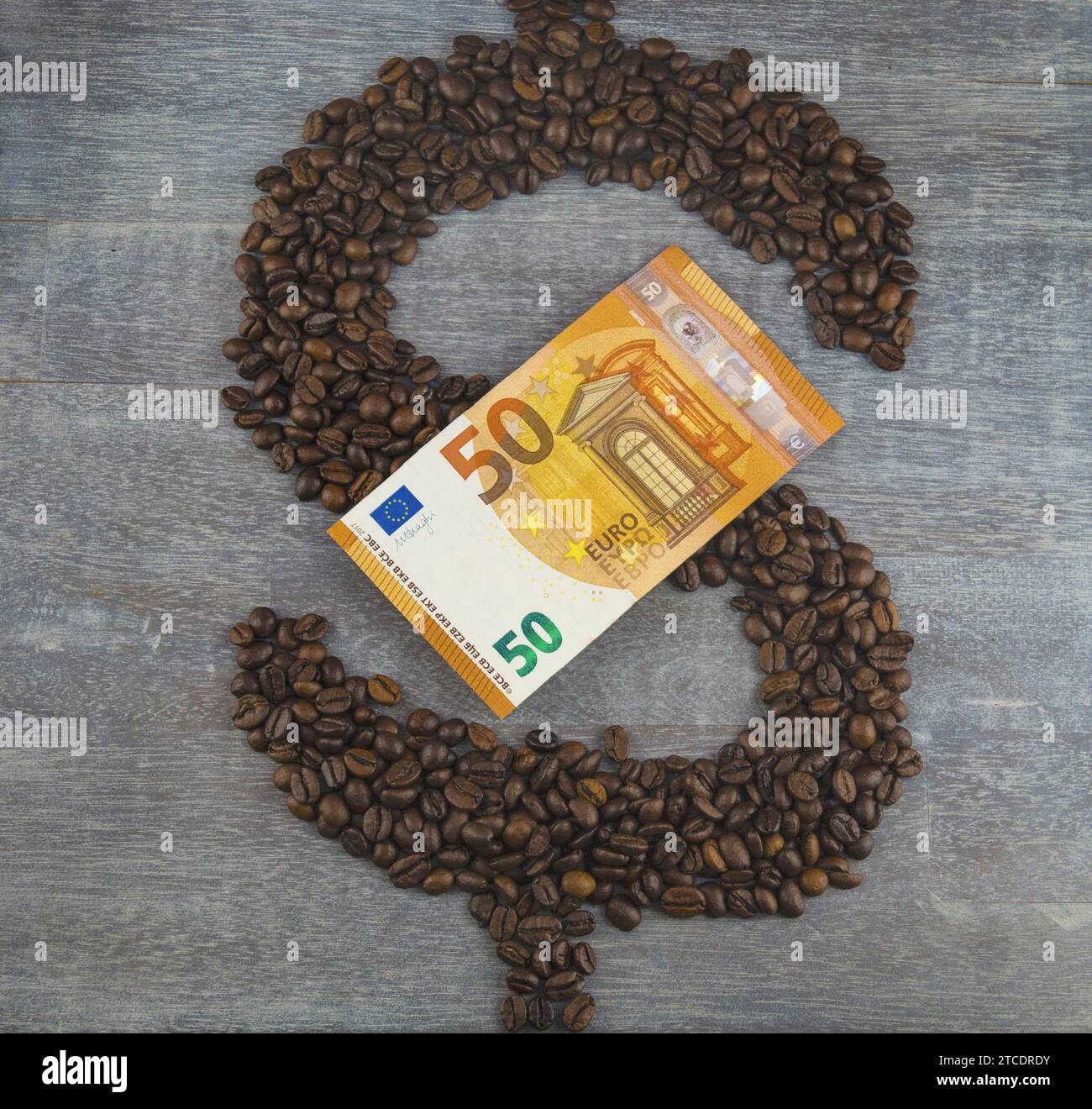 Dollar sign, formed with roasted coffee beans, with Euro bill, coffee ...