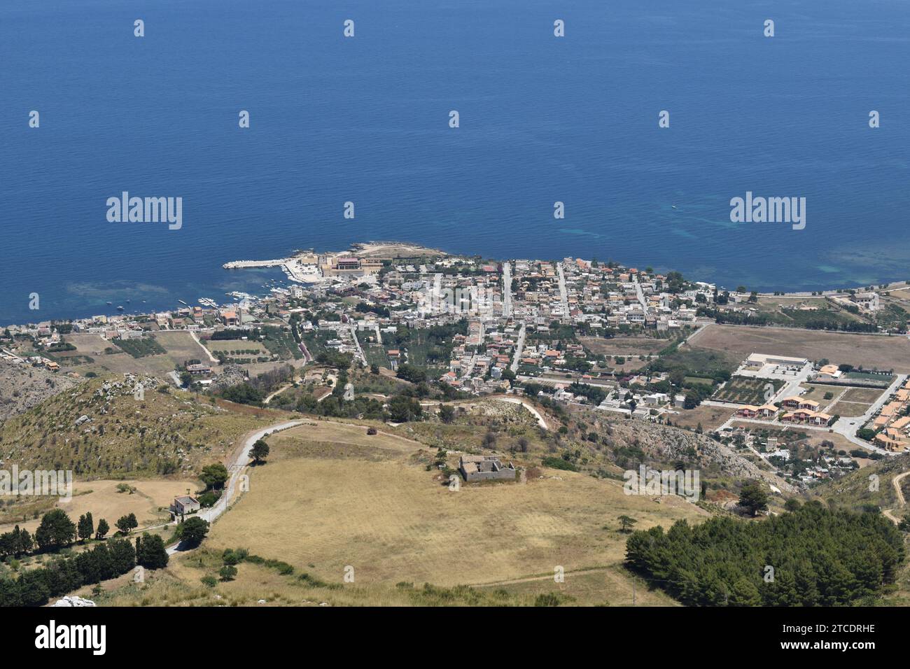 Distant view of the Sicilian town Tonnara di Bonagia as seen from Mount ...