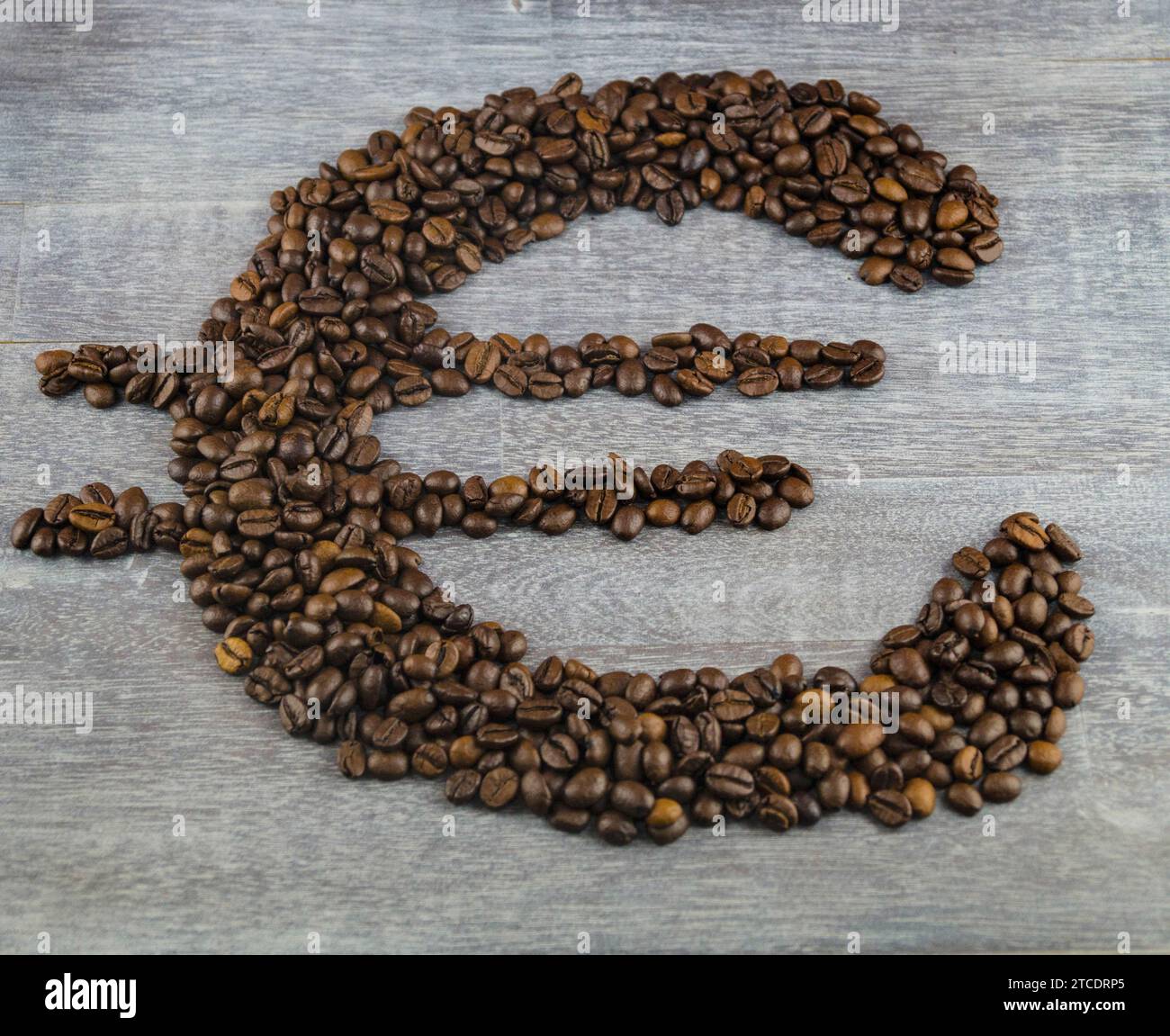 Euro sign, formed with roasted coffee beans, coffee price Stock Photo ...