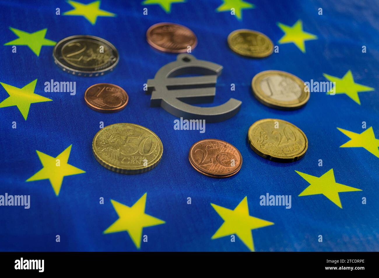 flag of EU with Euro sign and coins, Europe Stock Photo - Alamy