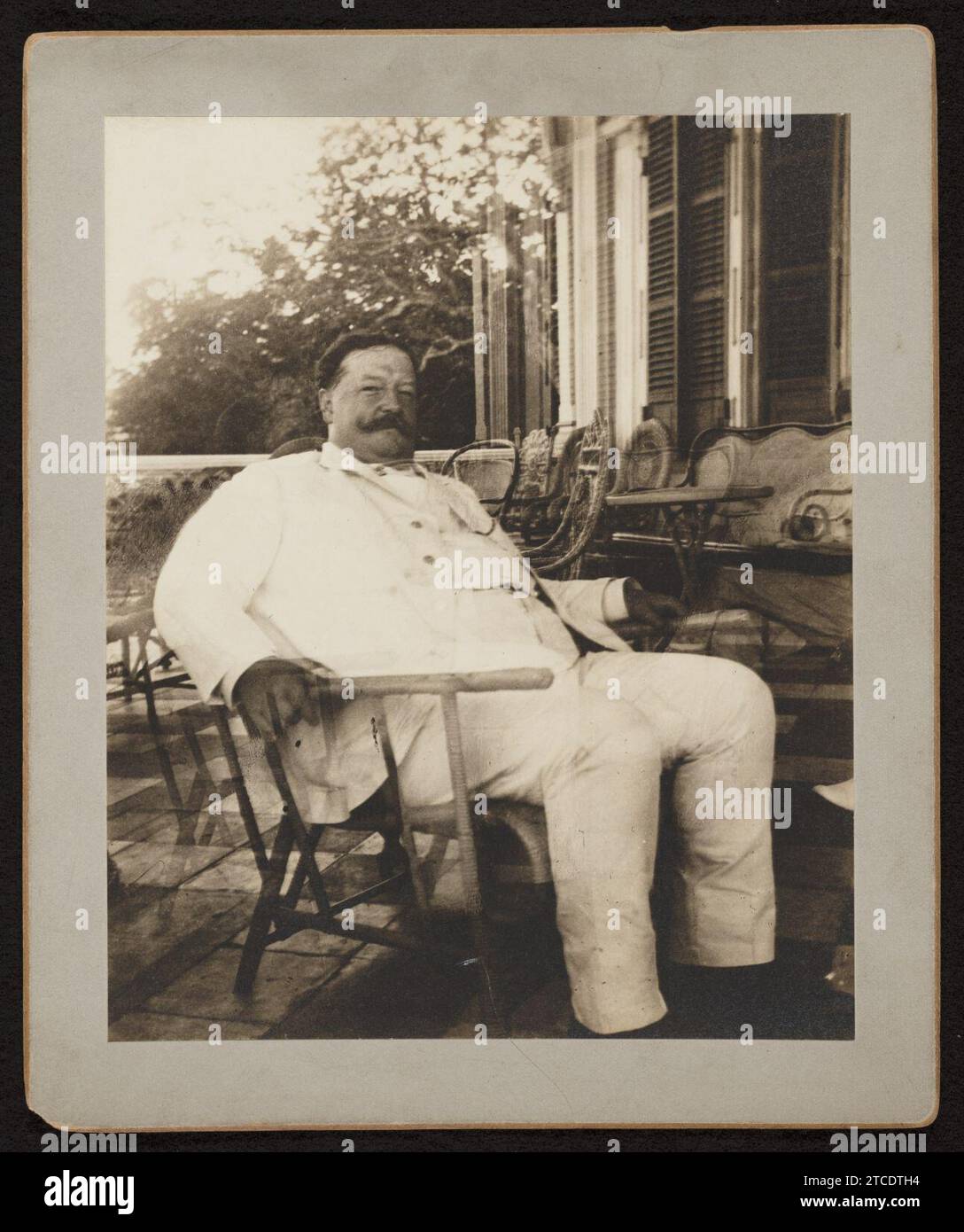 William H. Taft, seated in a wicker chair, probably during his tenure ...