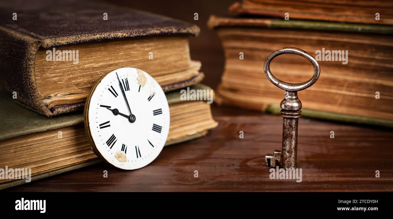 Old clock face, key and books, escape room game, time banner background ...