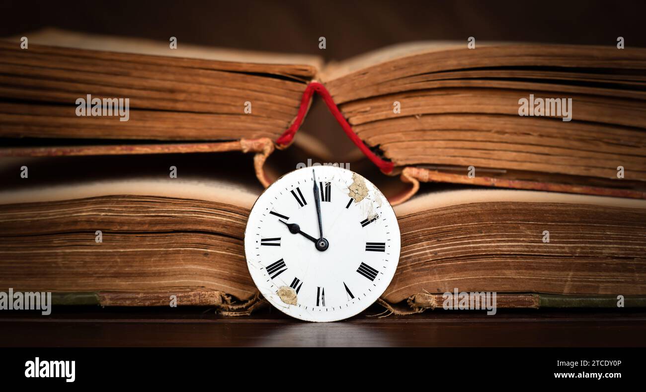 Old book and antique clock face. Storytelling, story teller, time ...