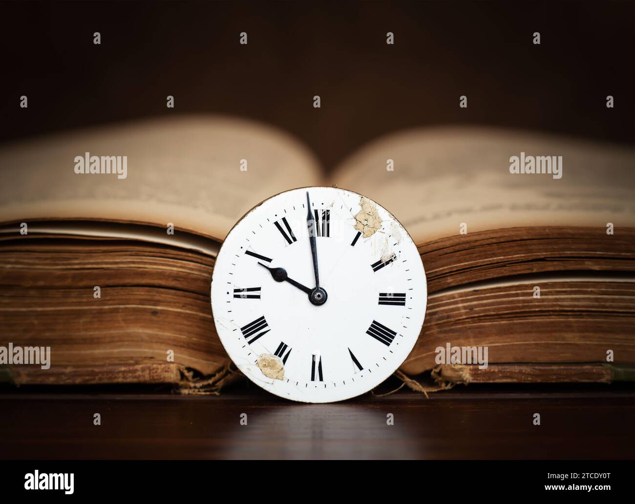 Old book and antique clock face. Storytelling, storyteller, time ...