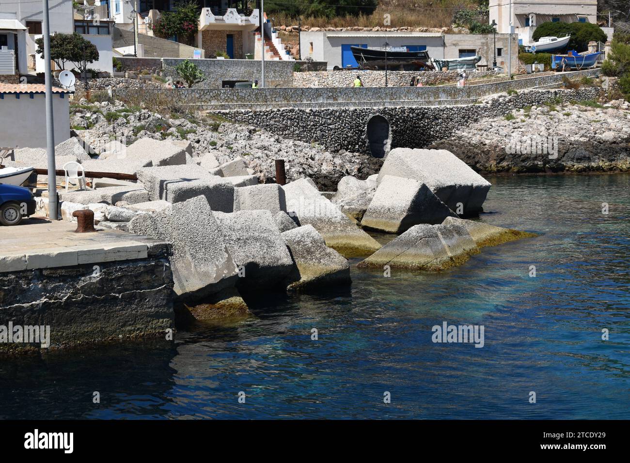 Concrete blocks in the water in the port of Levanzo to protect the ...