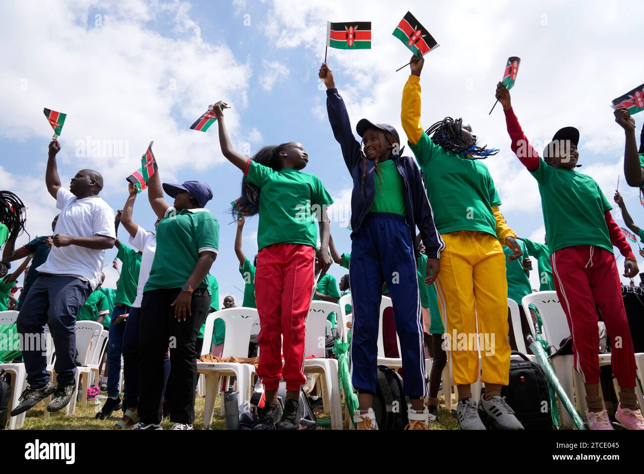 People jump and wave Kenyan flags during the 60th Jamhuri Day ...