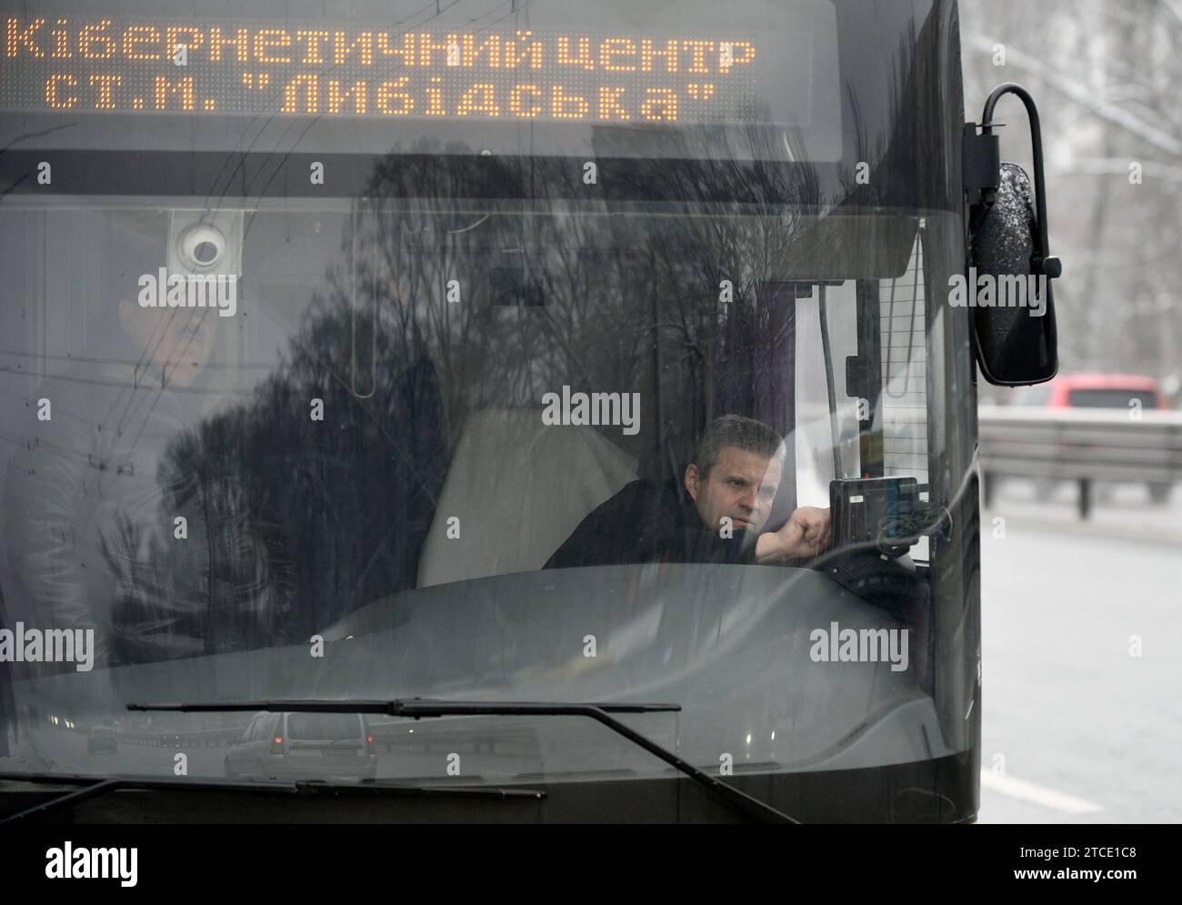 KYIV, UKRAINE - DECEMBER 11, 2023 - A driver sits in the cabin of a bus ...
