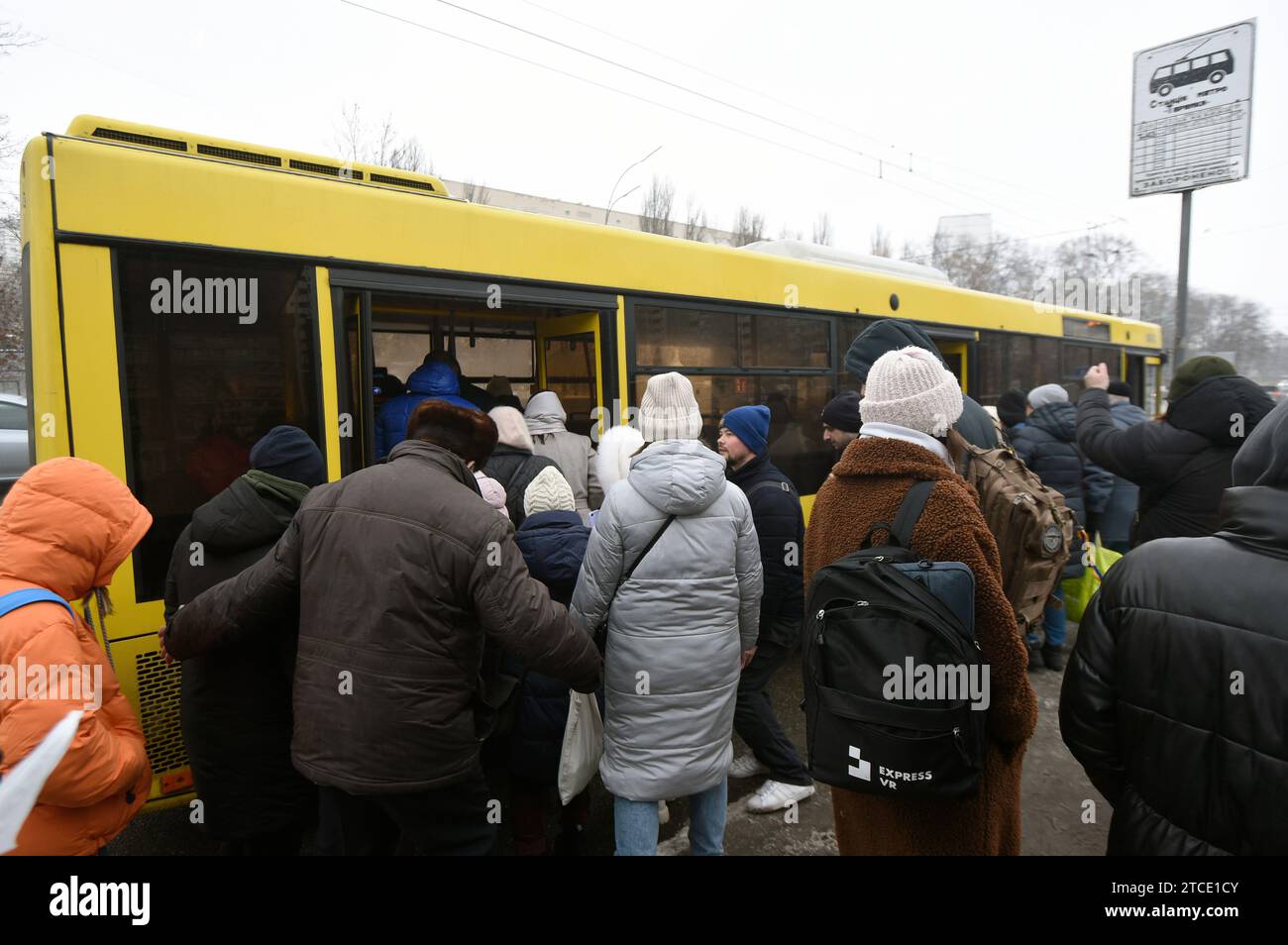 KYIV, UKRAINE - DECEMBER 11, 2023 - Passengers get on a bus that runs ...