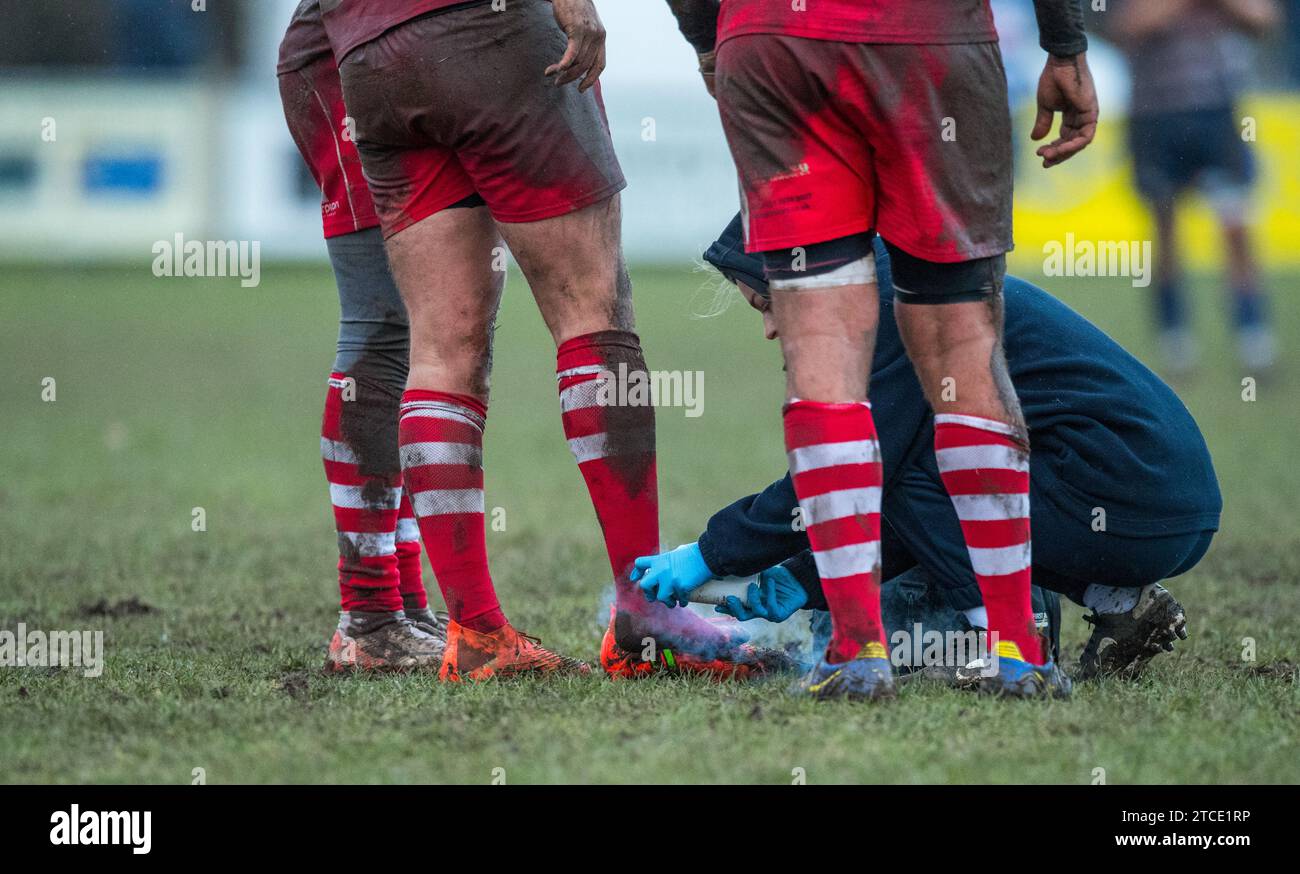 English amateur Rugby Union player recieving first aid treatment whilst ...