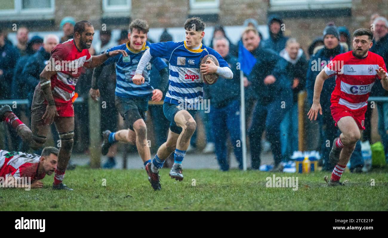 English amateur Rugby Union players playing in a league game wet and ...
