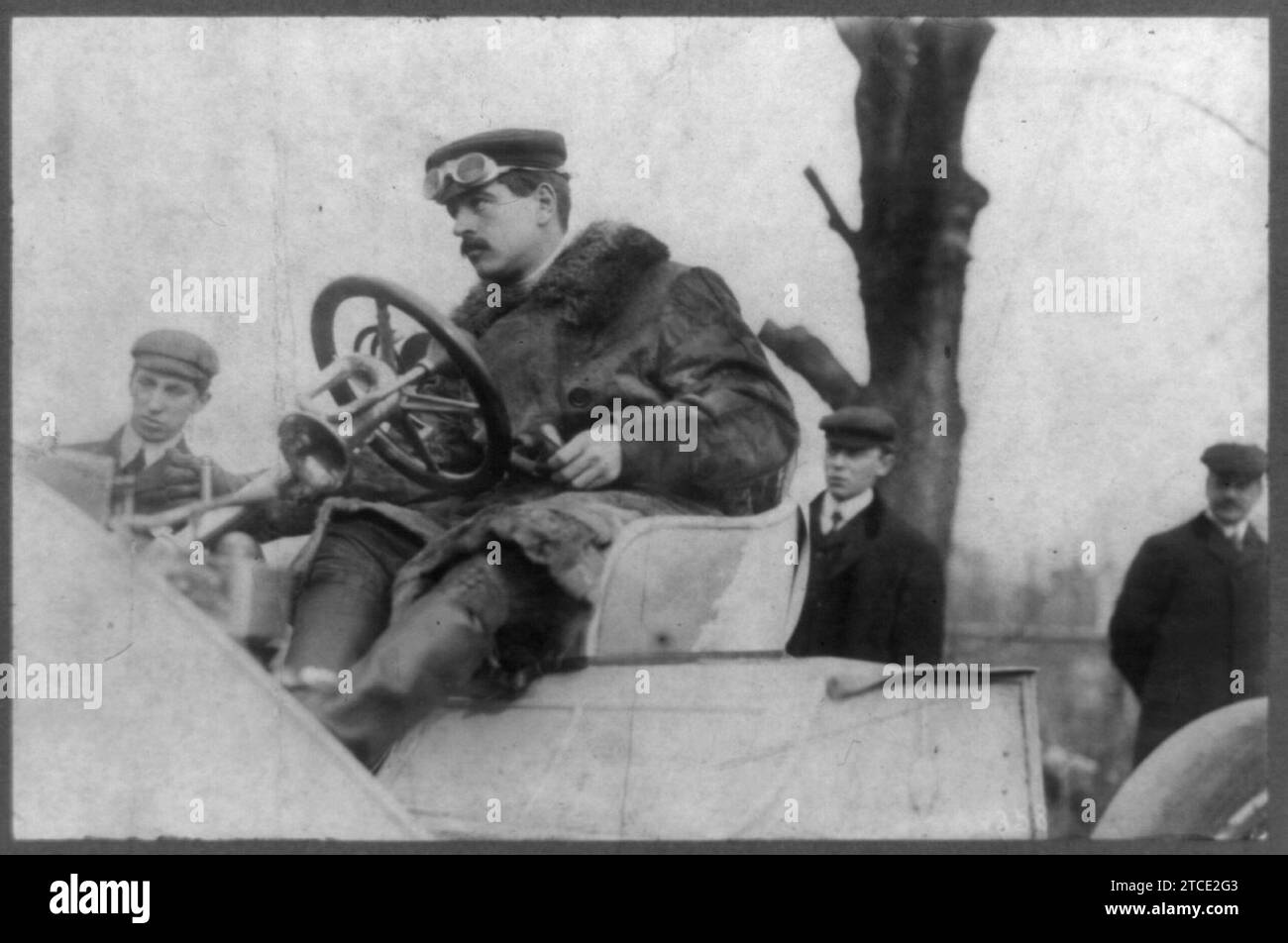 William Kissam Vanderbilt II, full-length portrait, seated at wheel of ...