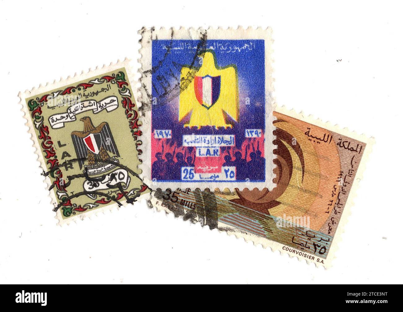 A montage of vintage postage stamps from Libya isolated on a white ...