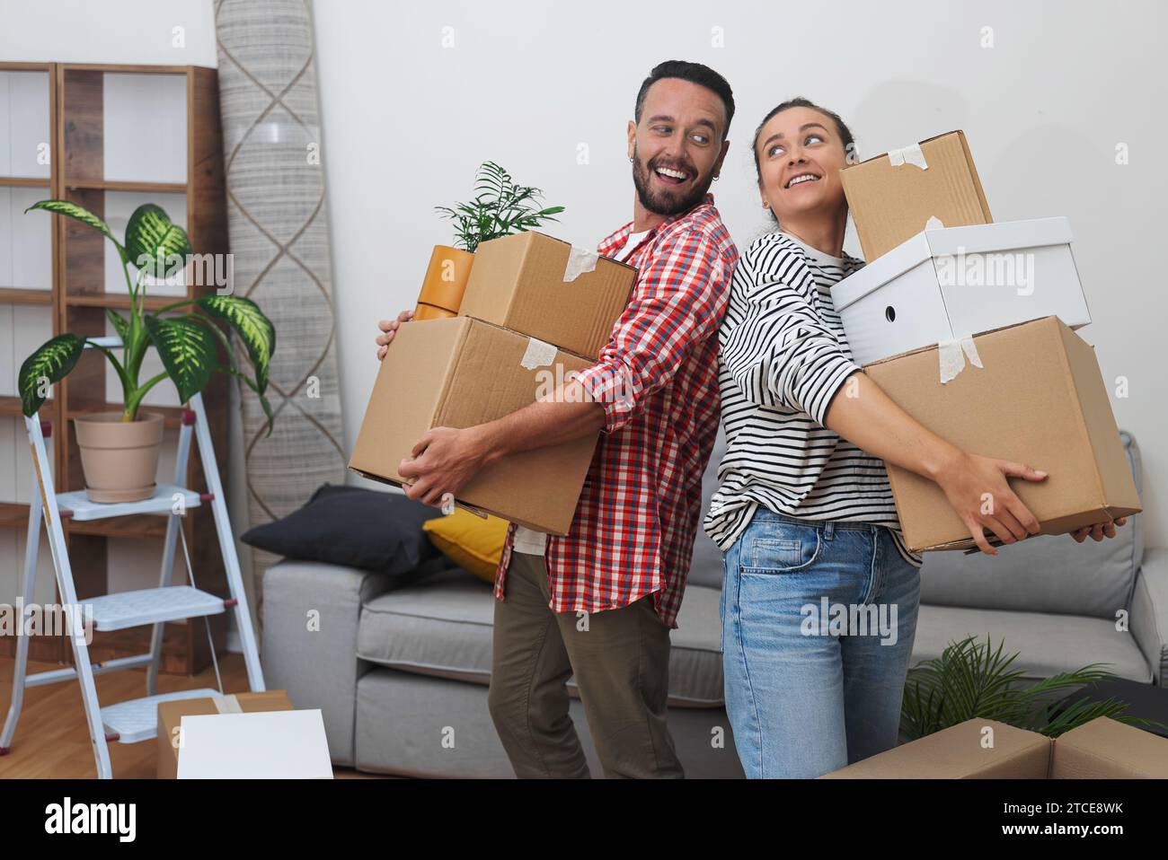 New Tenant Life: Young couple tenants, with cardboard relocation boxes ...