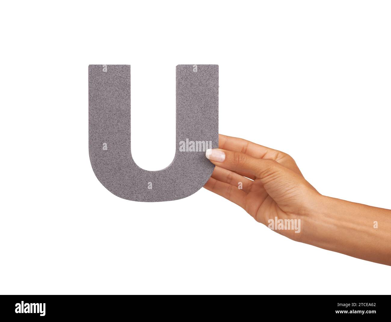 Hands, alphabet and capital letter U in studio isolated on a white ...