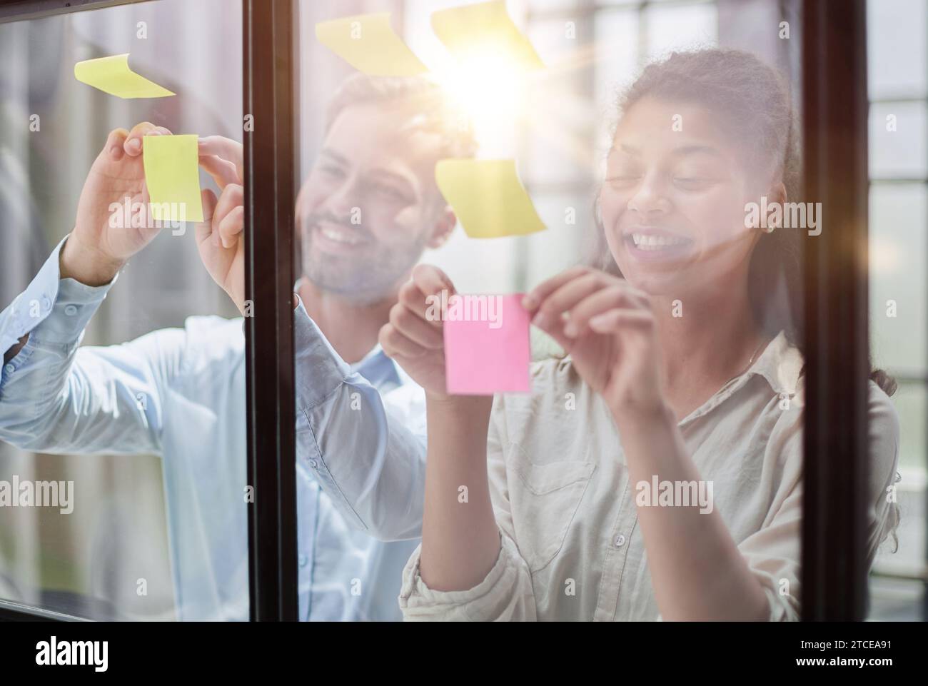 Group of business people behind glass wall at office Stock Photo - Alamy