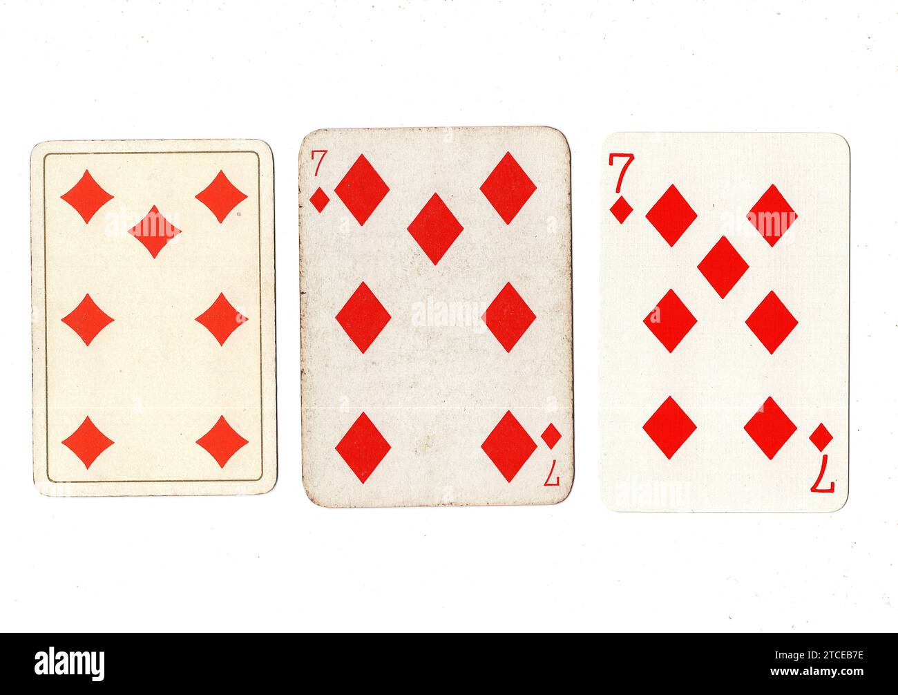 Three seven of diamonds vintage/antique playing cards in various ...