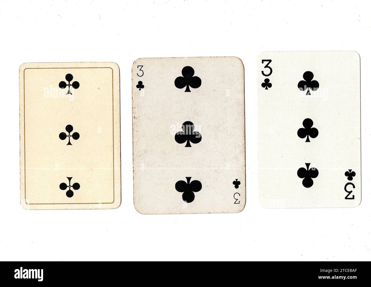 Three three of clubs vintage/antique playing cards in various designs ...