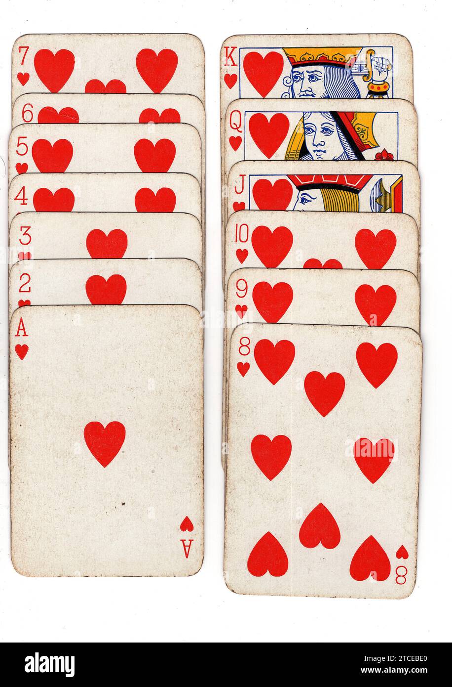 Vintage playing cards showing a full suit of hearts isolated on a white ...