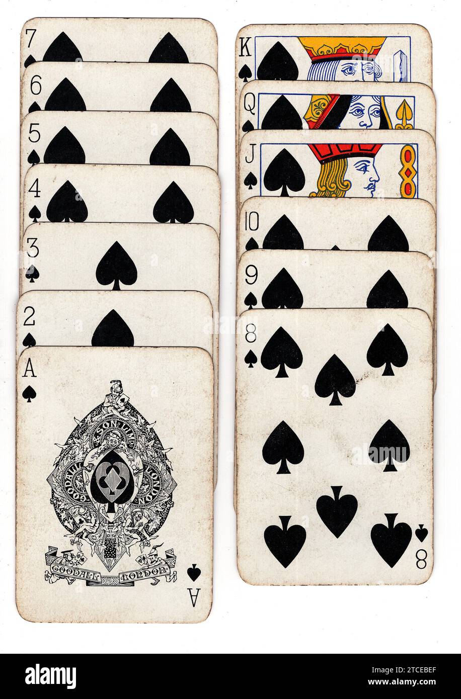 Vintage playing cards showing a full suit of spades isolated on a white ...