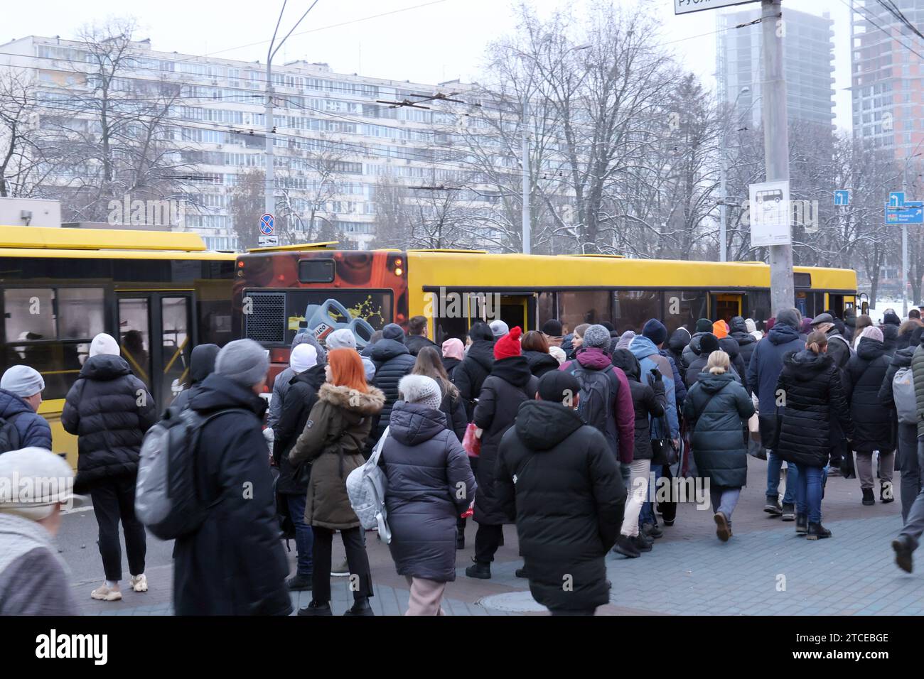 KYIV, UKRAINE - DECEMBER 12, 2023 - Passengers get on a bus at the ...