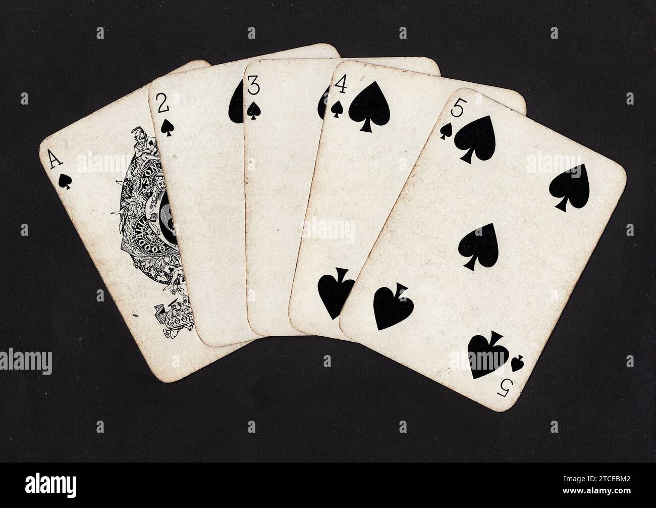 A poker hand of vintage playing cards showing a straight flush of ...