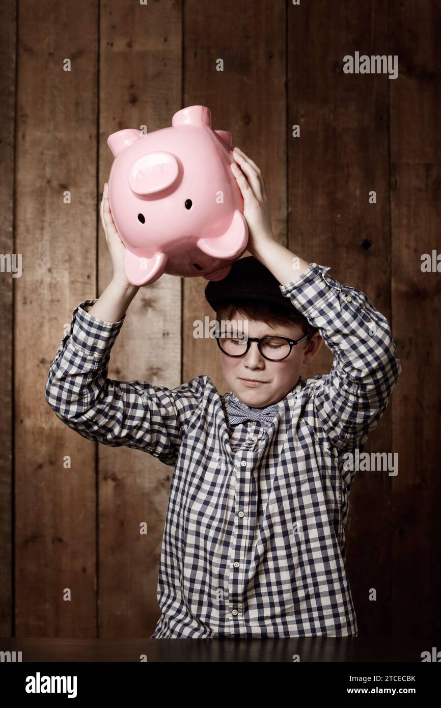 Piggy bank, smash and sad boy child with investment, growth or savings ...