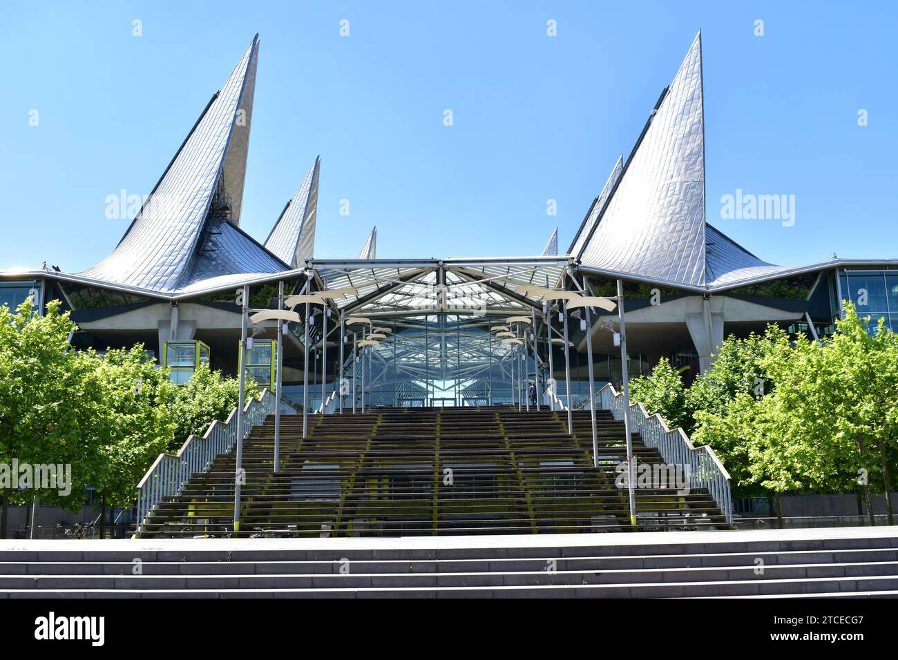 Wide staircase leading to the front entrance of the modern glass ...