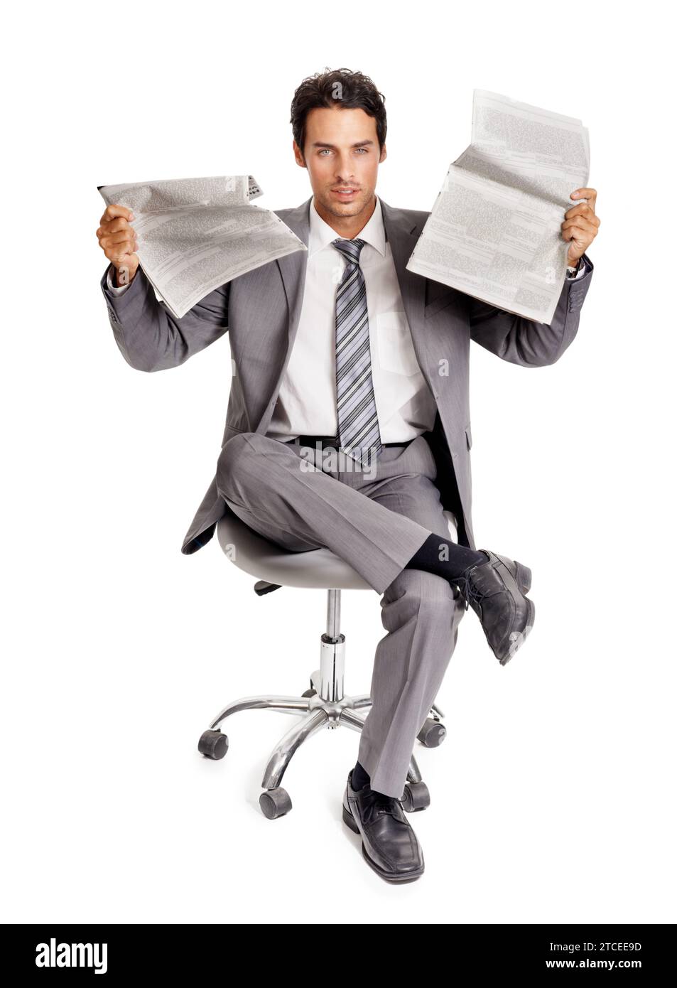 Business man, portrait and reading newspaper in studio, headlines and ...