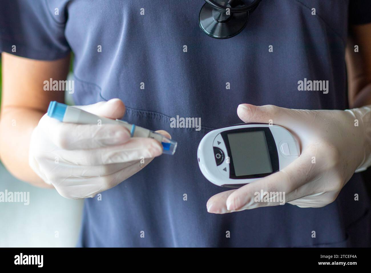 Close up shot of the nurse holding glucometer instrument Stock Photo ...