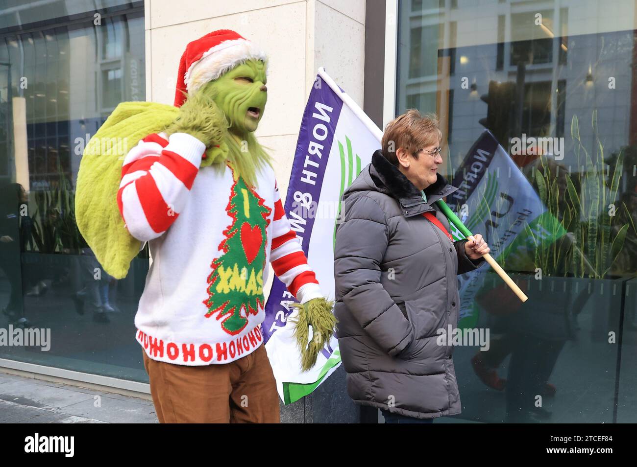 A person dressed as the Grinch with Maura McKenna, joint chair UNISON ...
