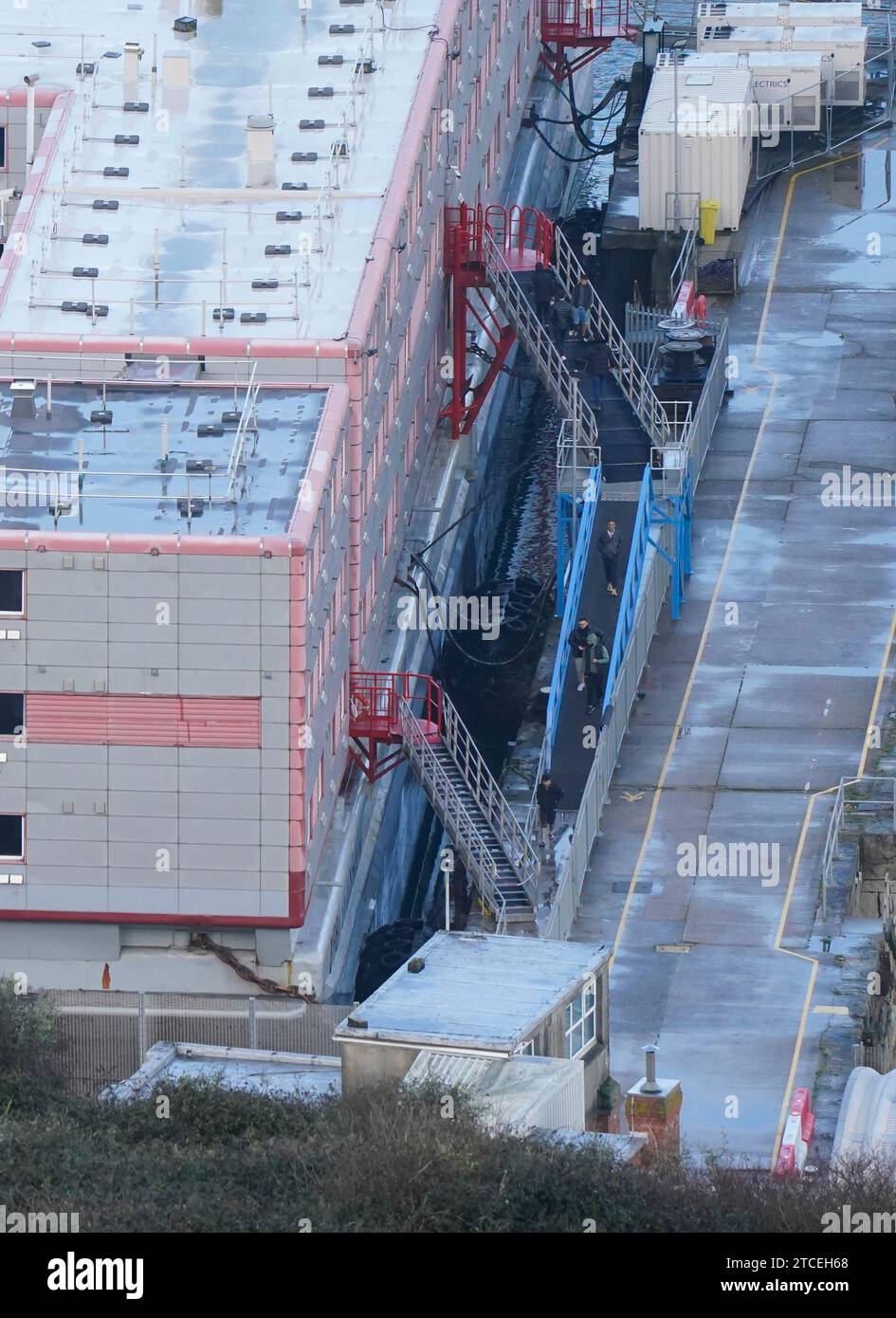 Migrants walk off the Bibby Stockholm accommodation barge following ...