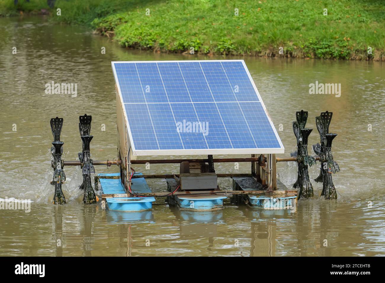 Solar Cell Panel Paddle Wheel Aerator in city park pond Stock Photo - Alamy