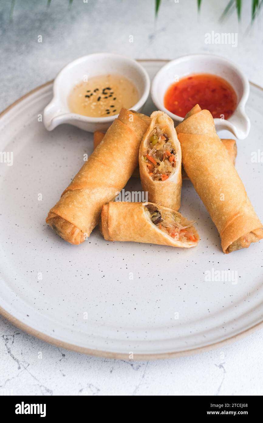 Crispy golden fried vegetable spring rolls with fresh ingredients ...