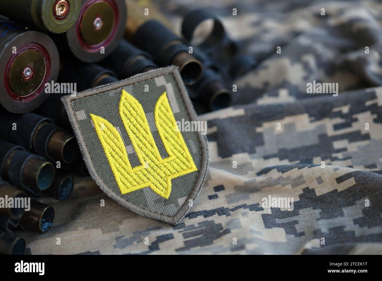Ukrainian army symbol on machine gun belt lies on ukrainian pixeled ...
