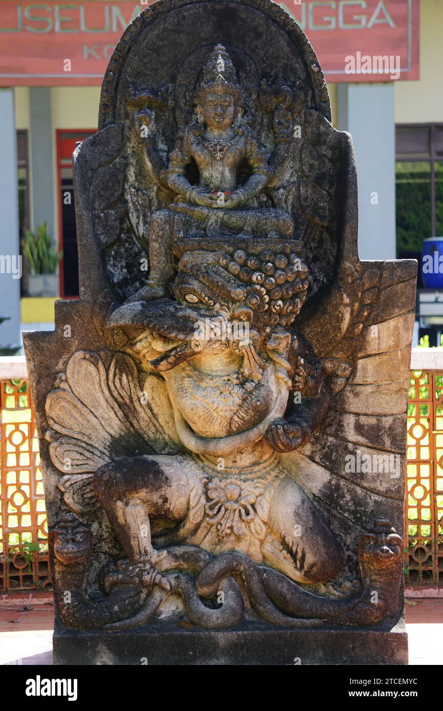The statue of King Airlangga riding the Garuda Bird with its legs ...