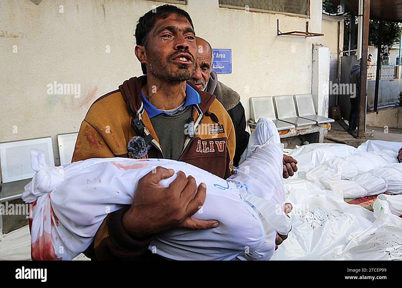 Rafah, Gaza. 12th Dec, 2023. A Palestinian man mourns the death of his ...