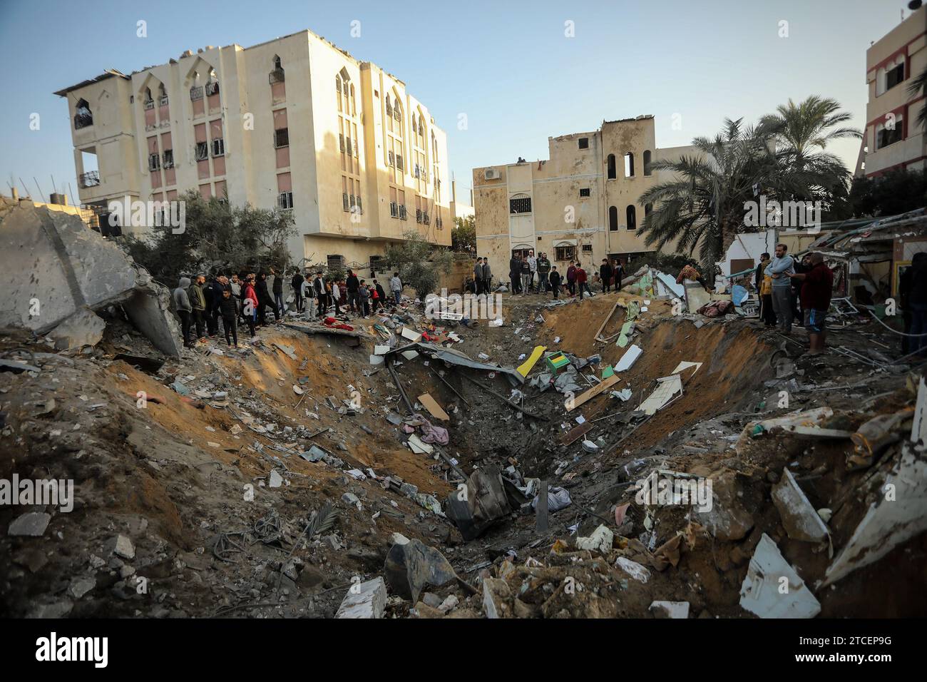 Rafah, Gaza. 11th Dec, 2023. People search house rubble for items to ...