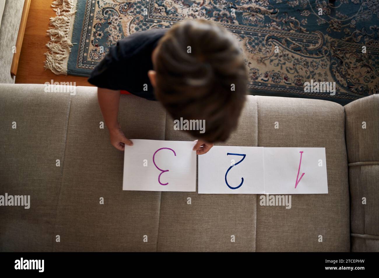 A boy with autism puts numbers in order Stock Photo - Alamy