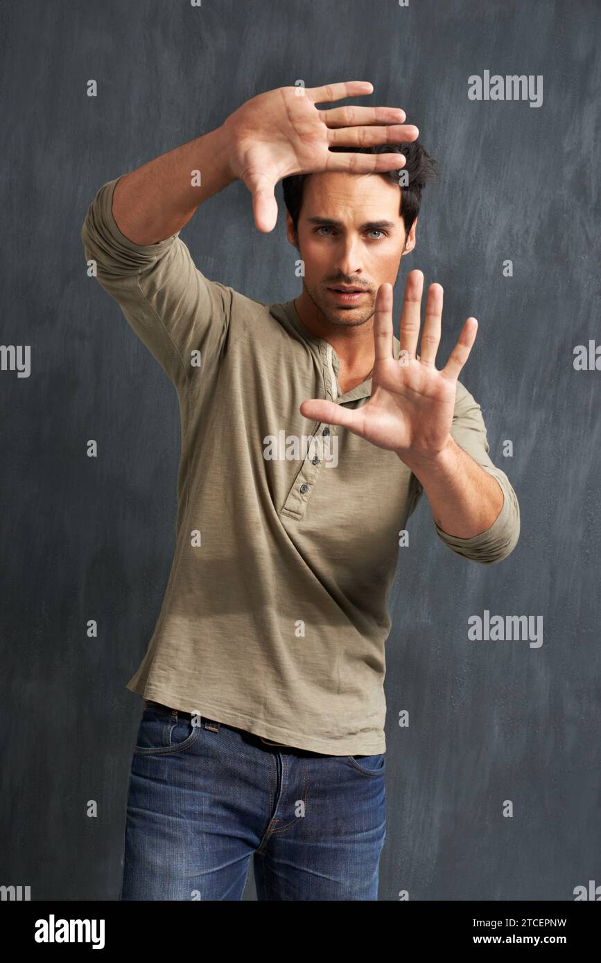 Hands, selfie frame and portrait of man in studio for photography ...