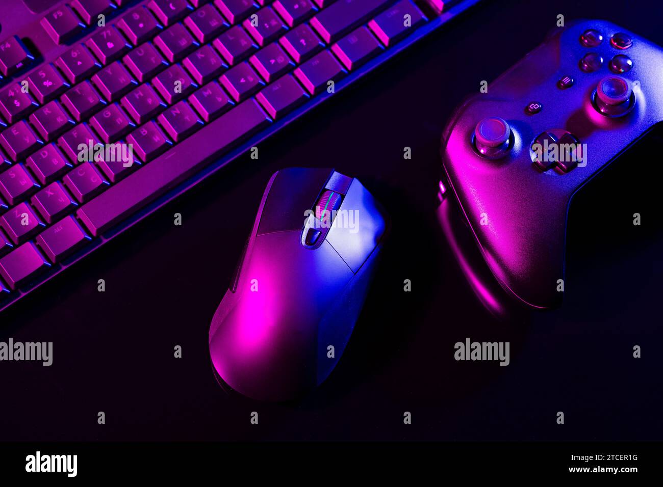 Computer keyboard, mouse and joystick on black background Stock Photo ...