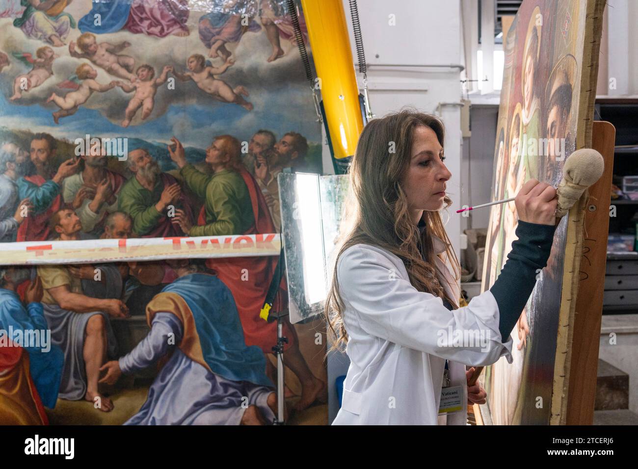 Vatican City, Vatican. 11th Dec, 2023. Restorer Caterina Manisco works ...