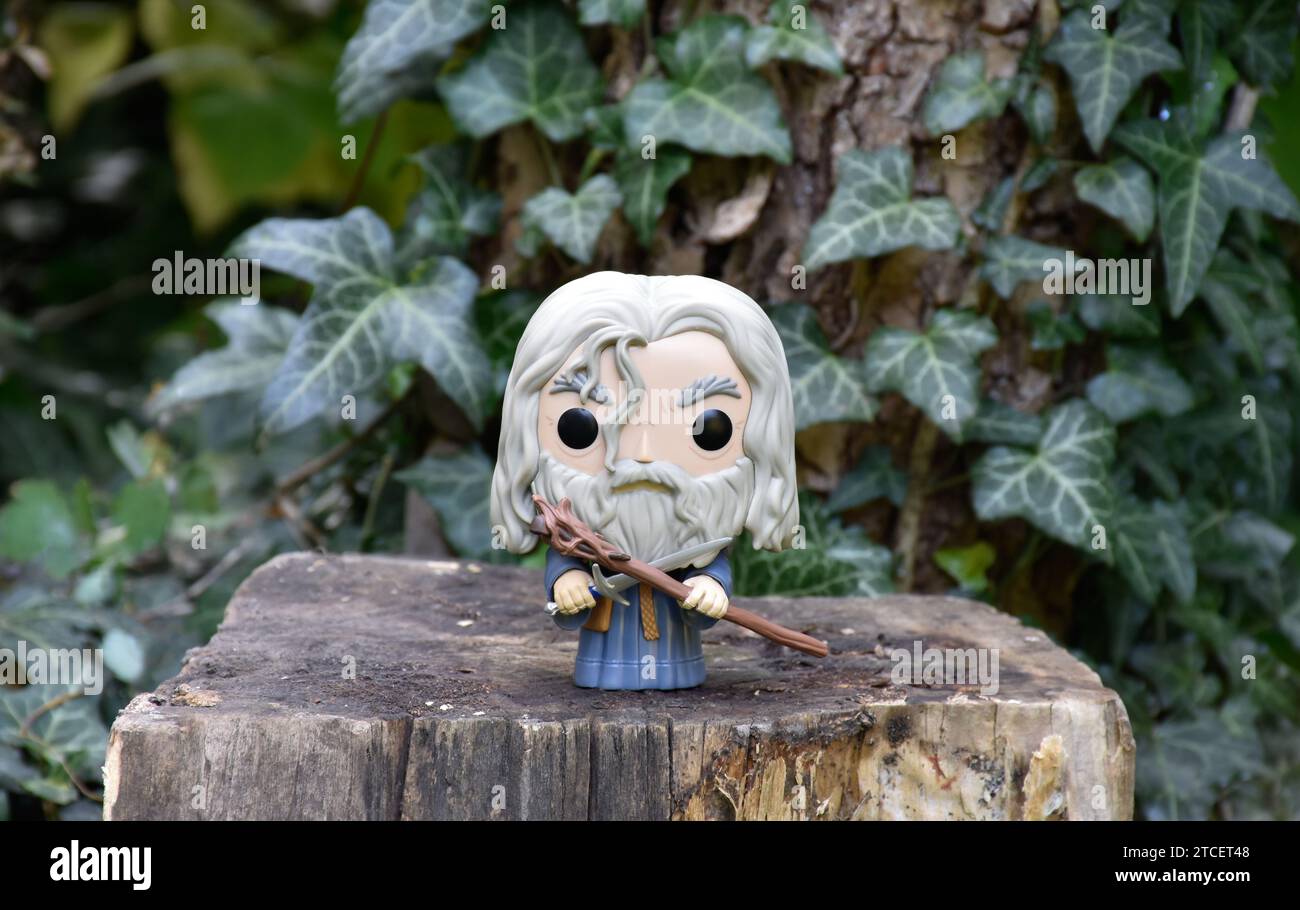 Funko Pop action figure of wizard Gandalf the Grey holding sword and ...