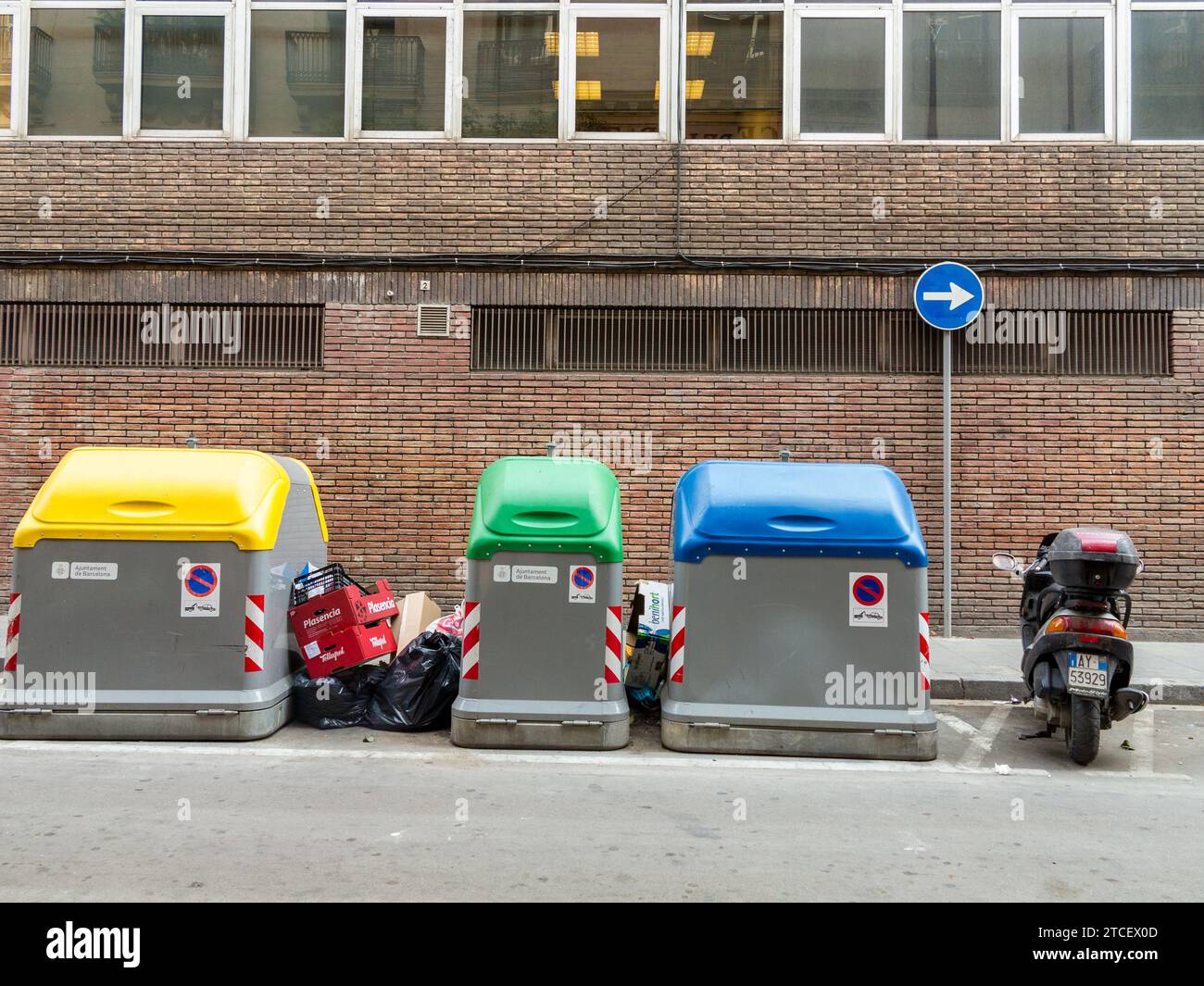 Waste containers with yellow, green and blue lids. Barcelona, Spain ...